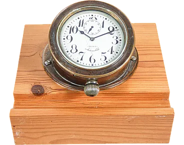 Brass clock with wooden base by Doxa, 1940s | intOndo